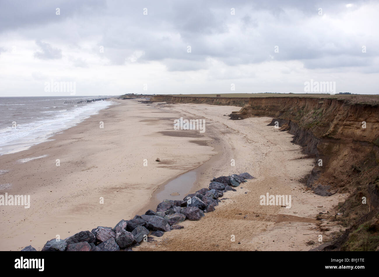 Rock armor protecting the Happisburgh coastline, Norfolk, UK Stock ...