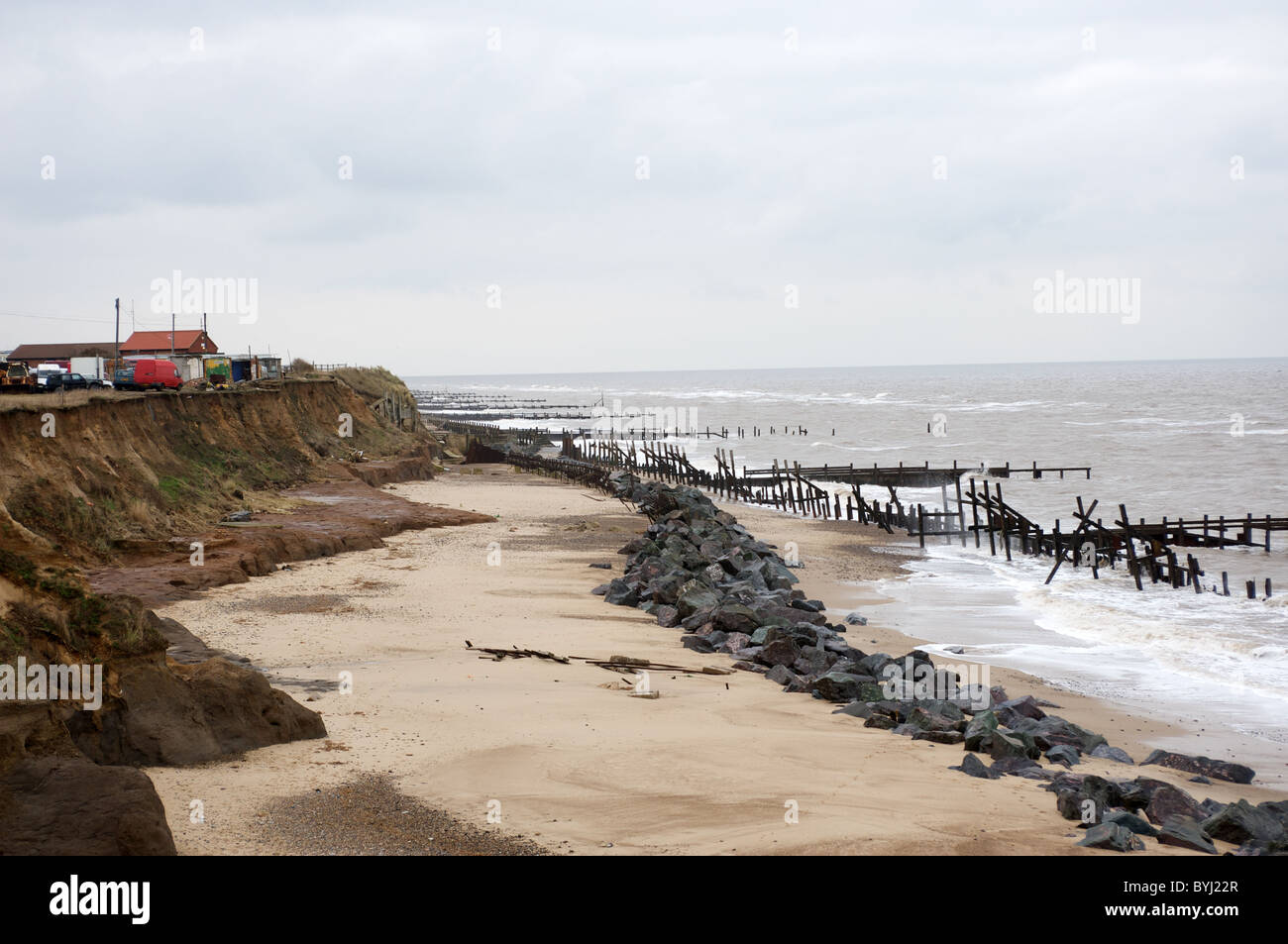 Rock armor protecting the village Happisburgh, Norfolk, UK Stock Photo ...