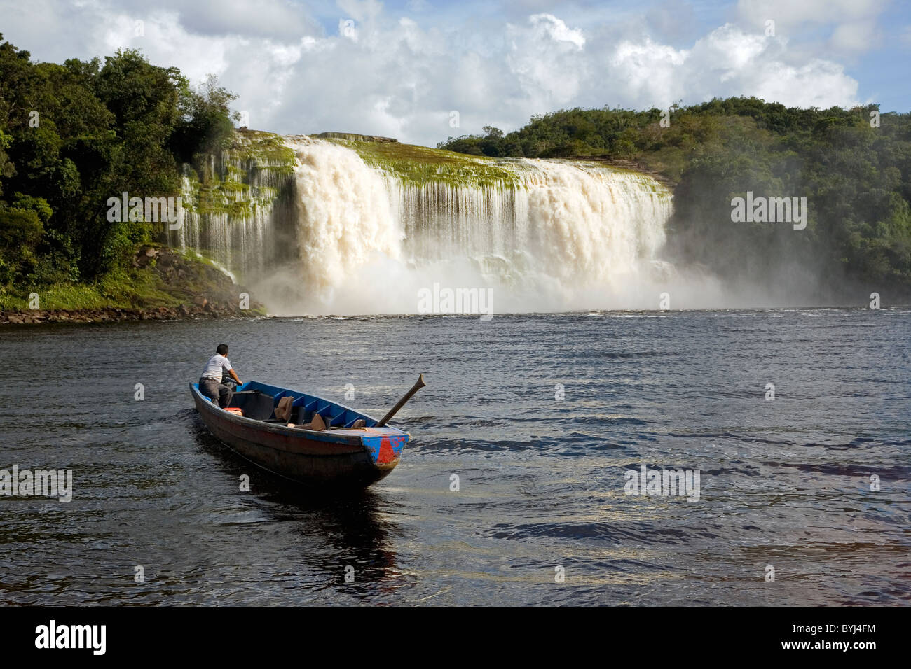 A Pemon tribe man while sailing with his boat at Canaima lake just in ...