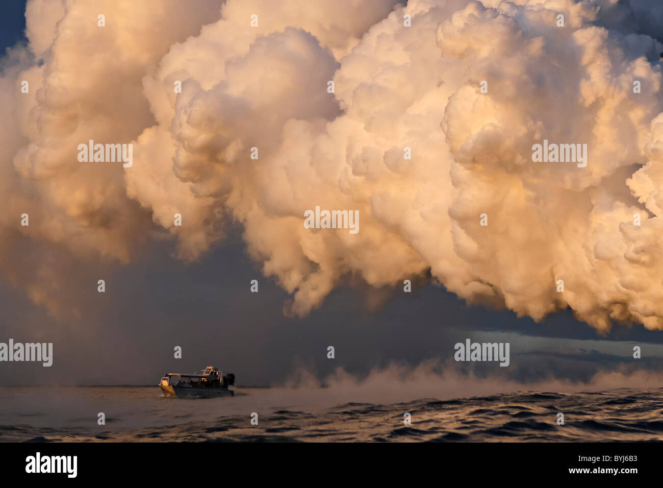 Boat next to steam plume, Big Island, Hawaii, USA Stock Photo - Alamy