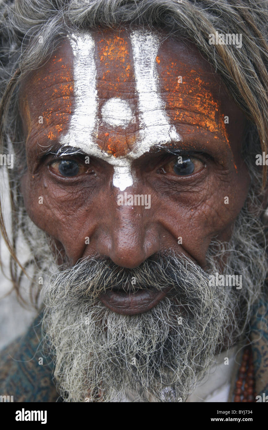 FACE PORTRAIT OF A BEGGAR HINDUIST INDIAN OLD MAN WITH PAINTED FACE AND ...