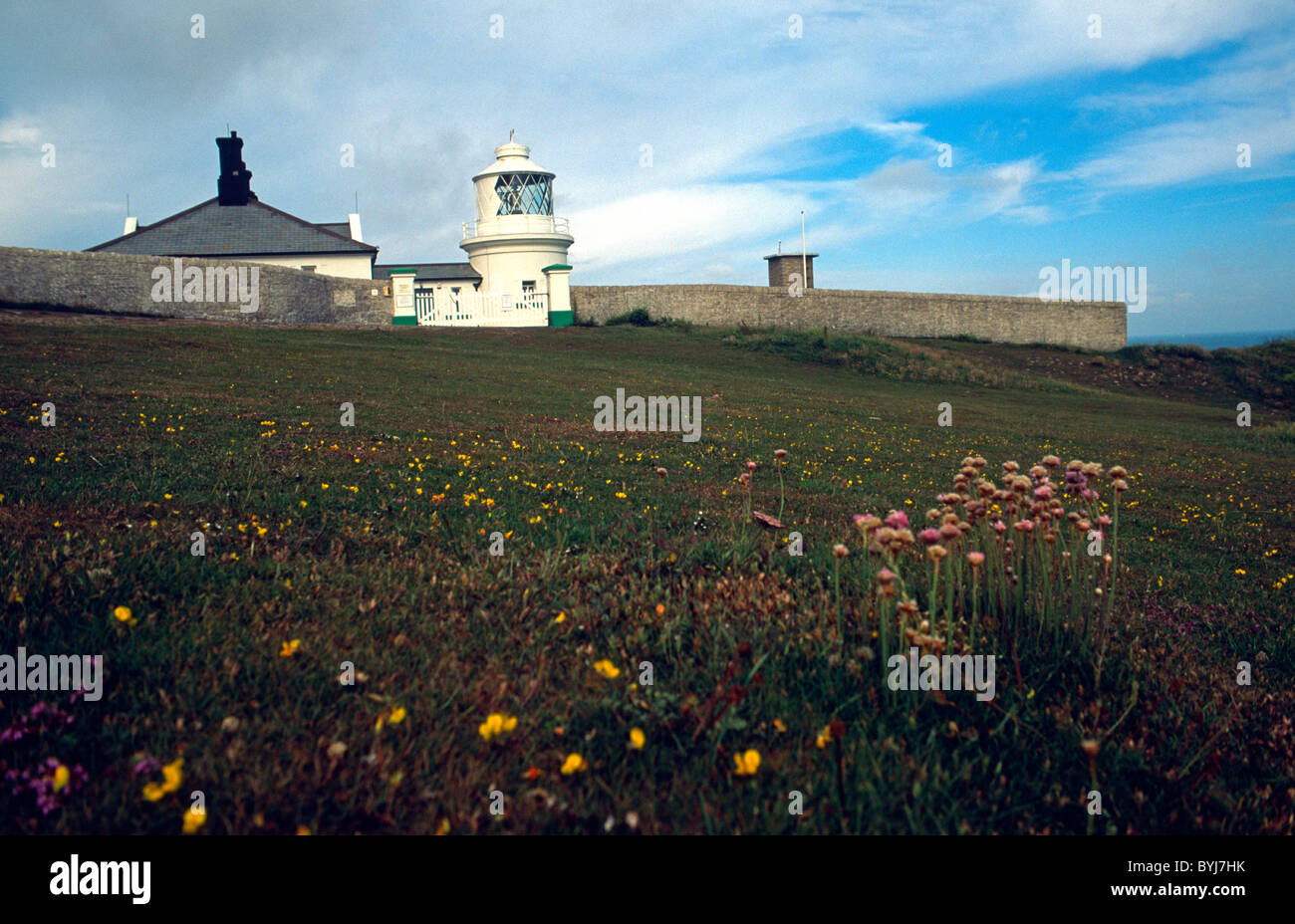 Anvil Point lighthouse, near Swanage, Dorset. The coastguard cottages ...