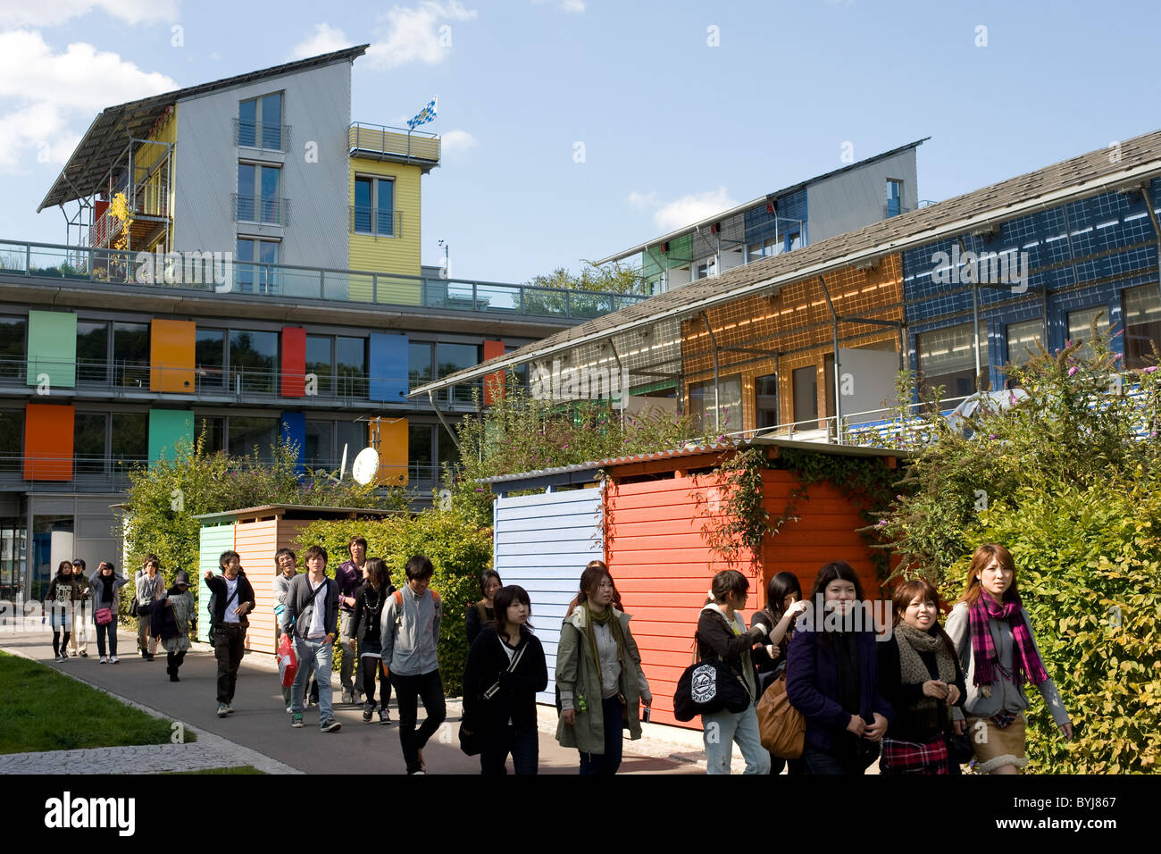 Japanese tourists in the solar village in Vauban District, Freiburg ...