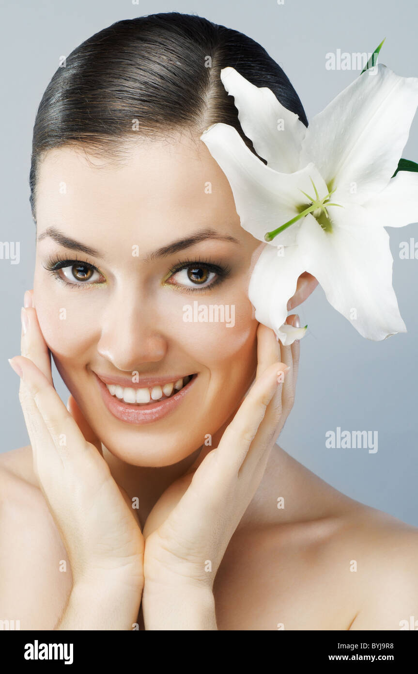beauty flower girl on the blue background Stock Photo - Alamy