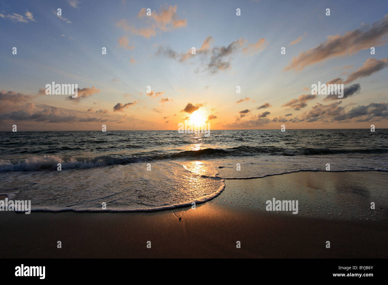 Sunset at the sea Stock Photo - Alamy