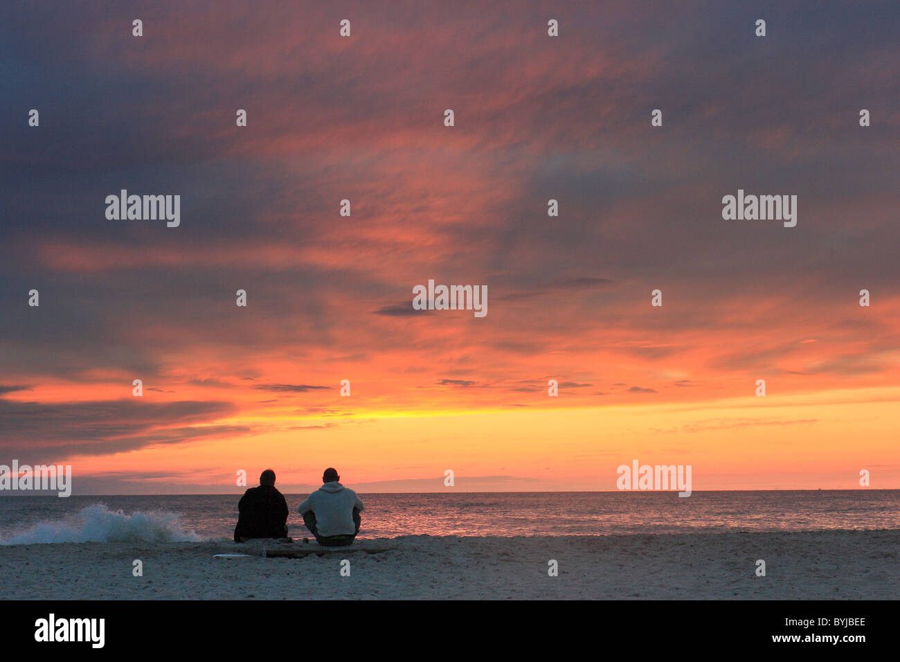 Two men watching sunrise hi-res stock photography and images - Alamy