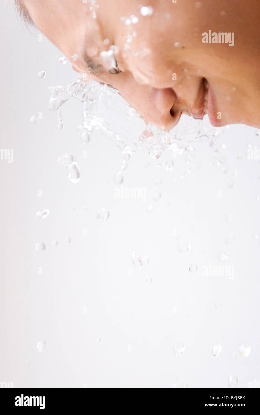Woman washing her face hi-res stock photography and images - Alamy
