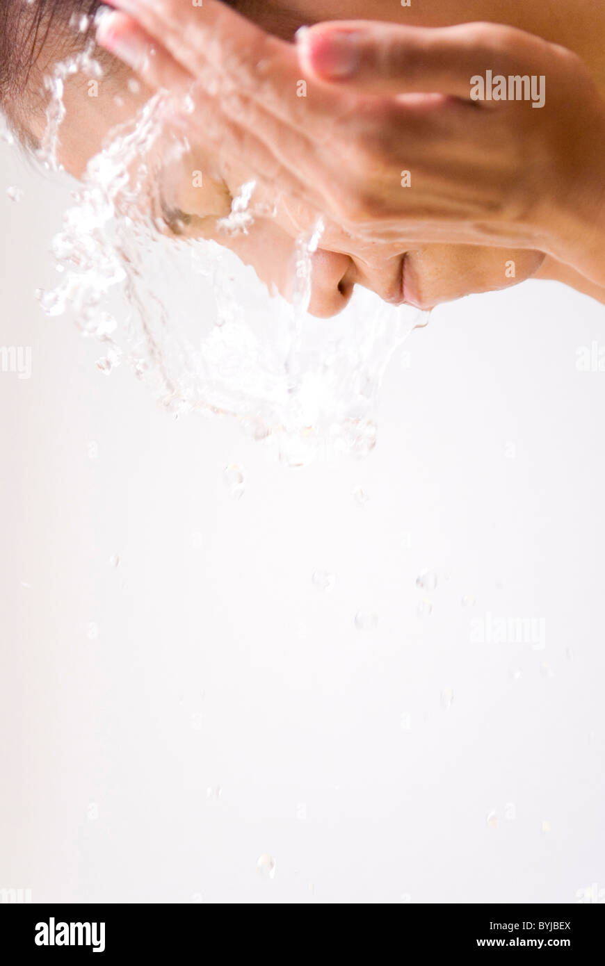 Young Woman Washing Face Stock Photo - Alamy
