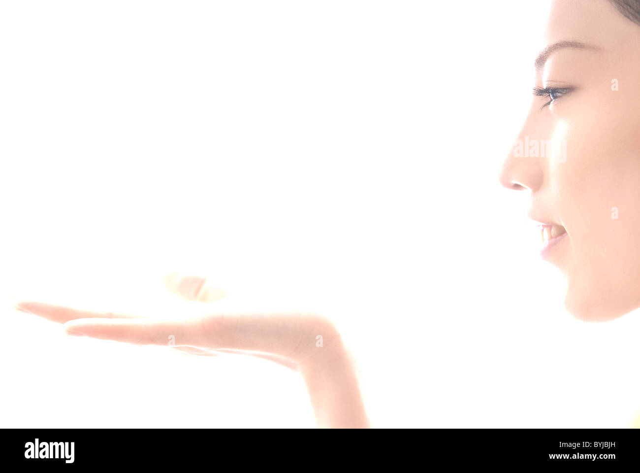 Young Woman Holding Object in Her Hand Stock Photo - Alamy