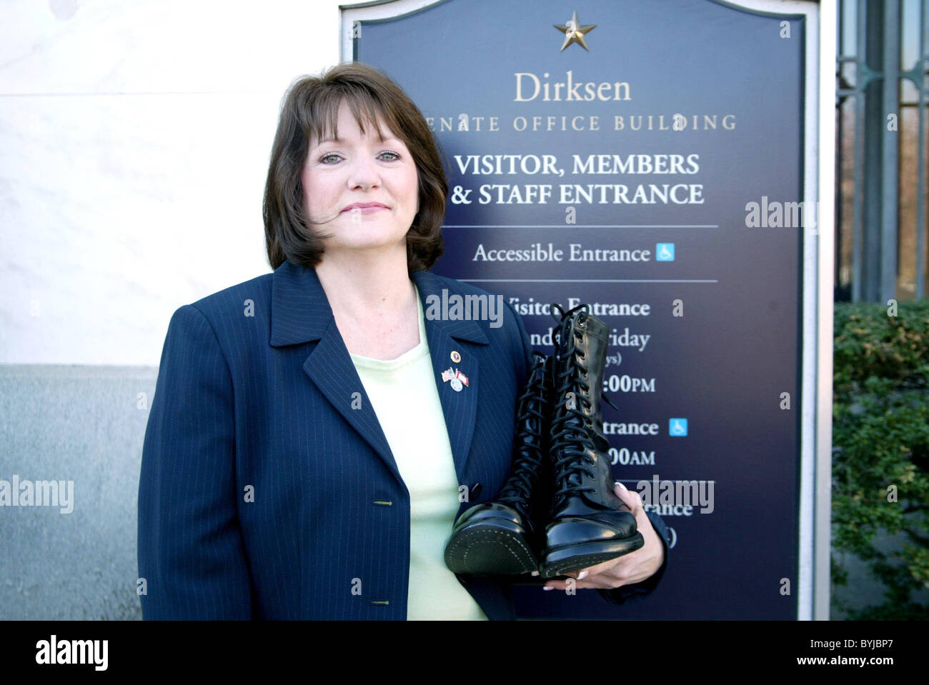 Military widow Suzanne Stack carries her husbands boots with her to the ...