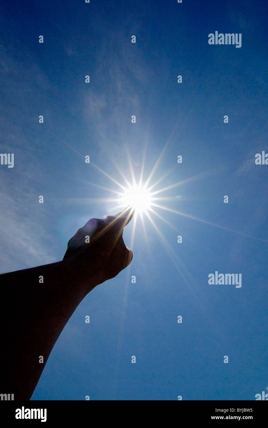 Person Pointing At Sun Stock Photo - Alamy