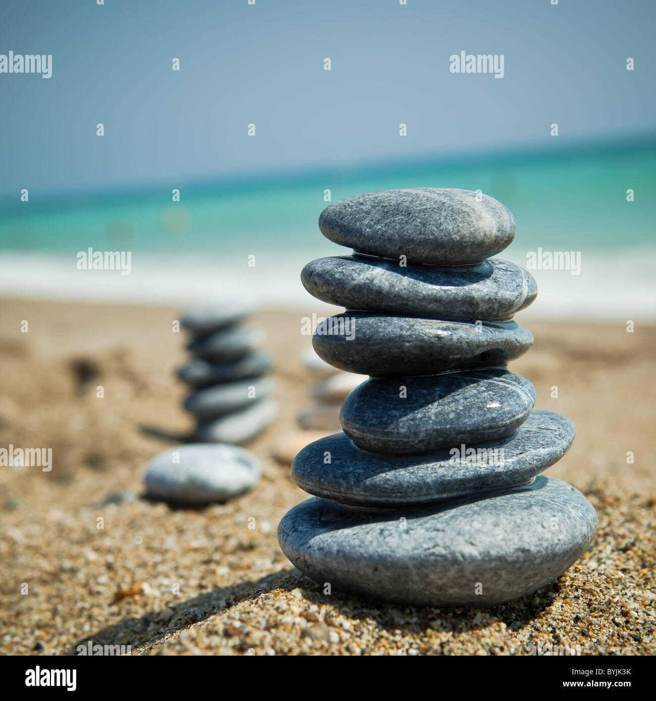 Stone stacks on a pebble beach Stock Photo - Alamy