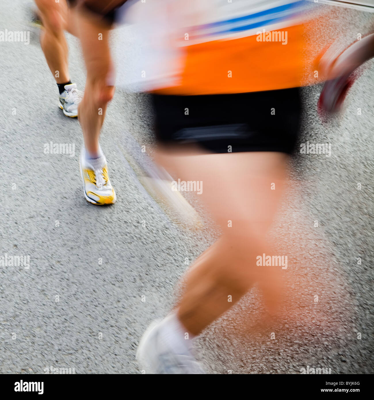 People running in city marathon - motion blur Stock Photo - Alamy