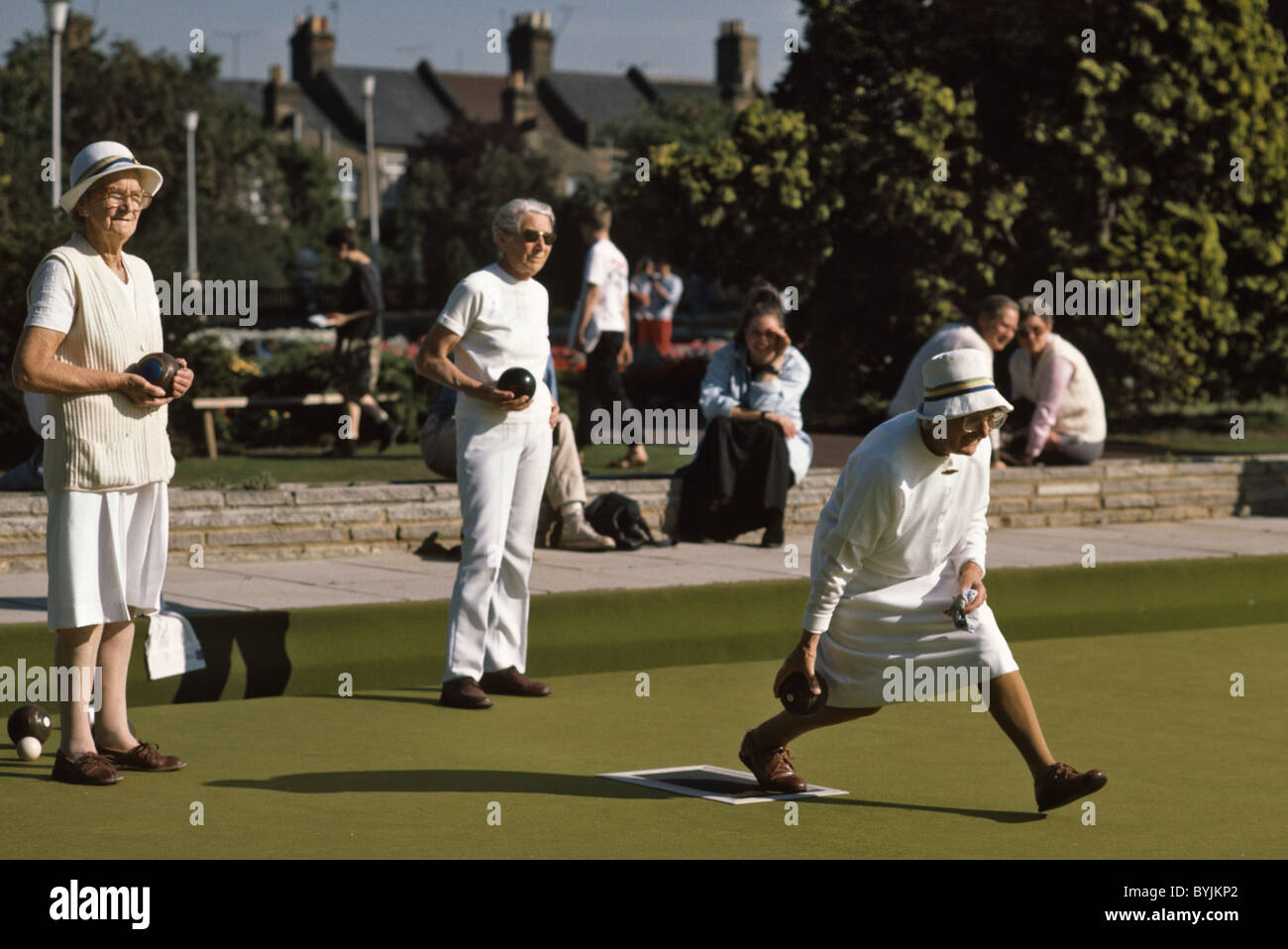 Old people playing lawn bowls Stock Photo - Alamy