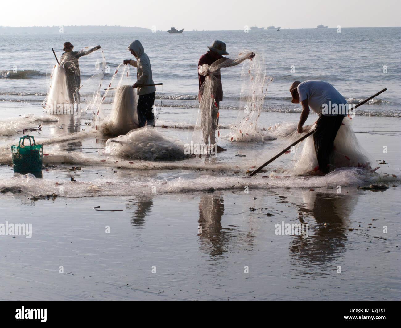 Woman casting net hi-res stock photography and images - Alamy