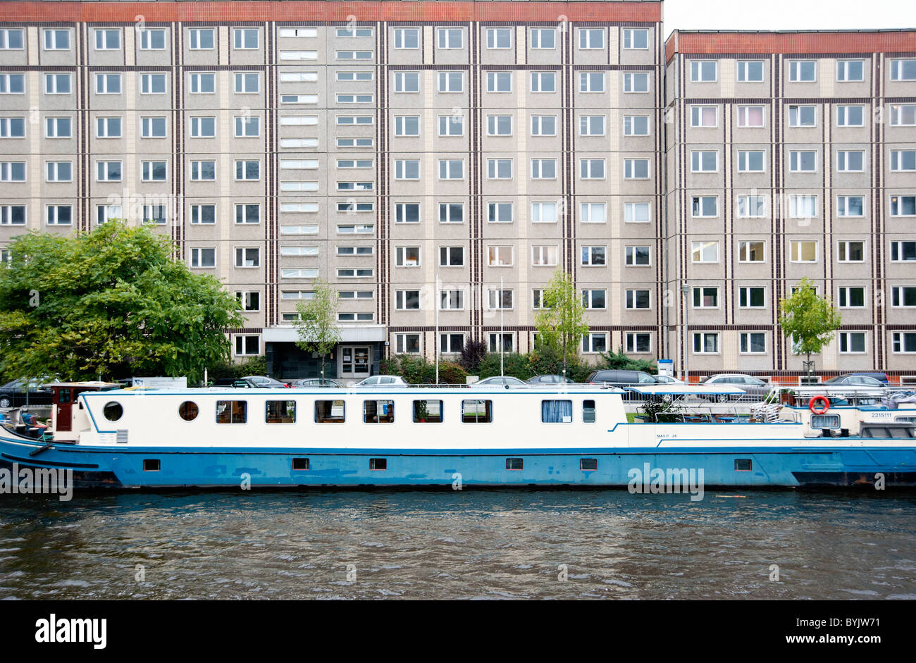River Spree in Berlin with boat, along the Schiffbauerdamm Stock Photo ...