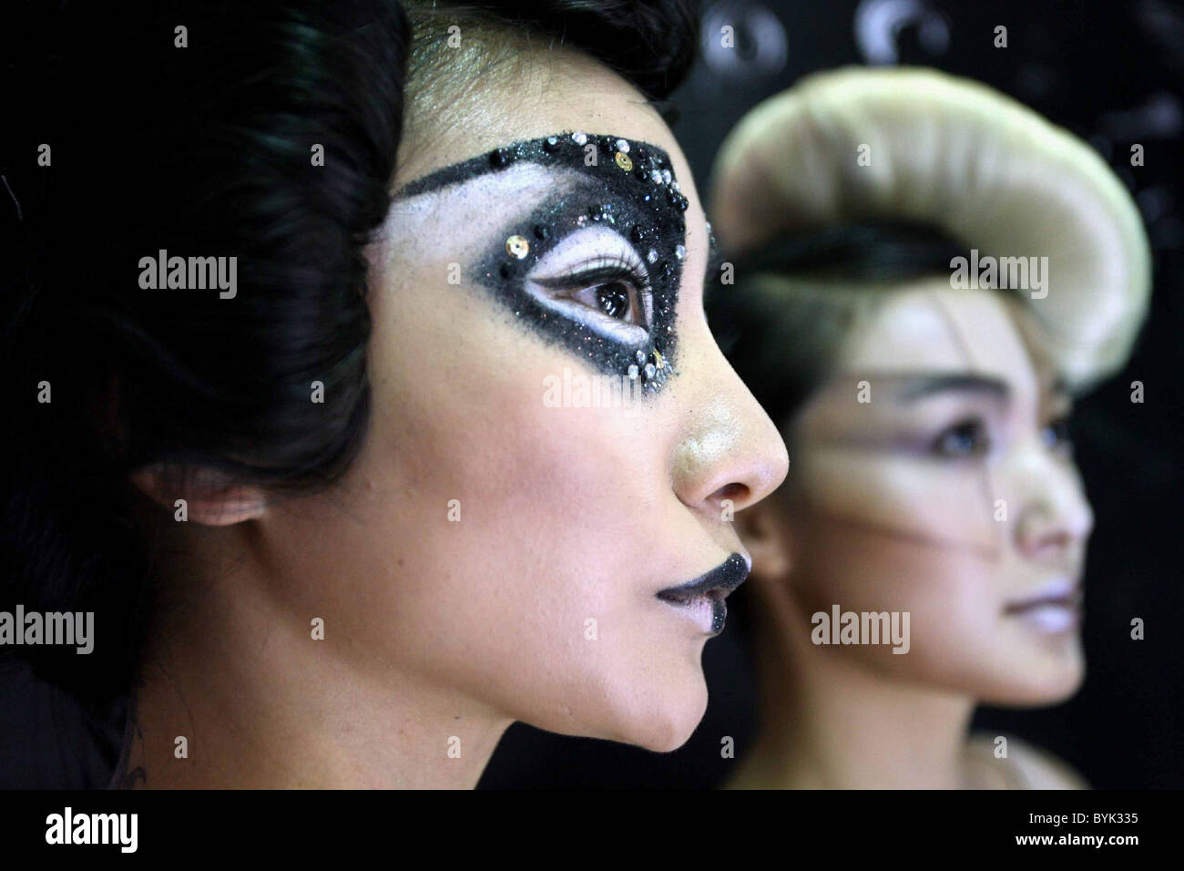 COLOURFUL MAKE UP Models show off their colourful make-up by Christian ...