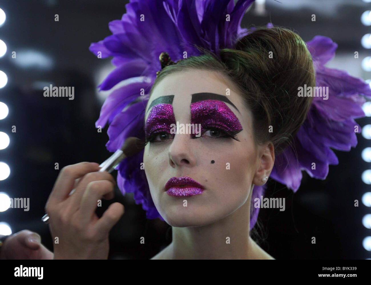 COLOURFUL MAKE UP Models show off their colourful make-up by Christian ...