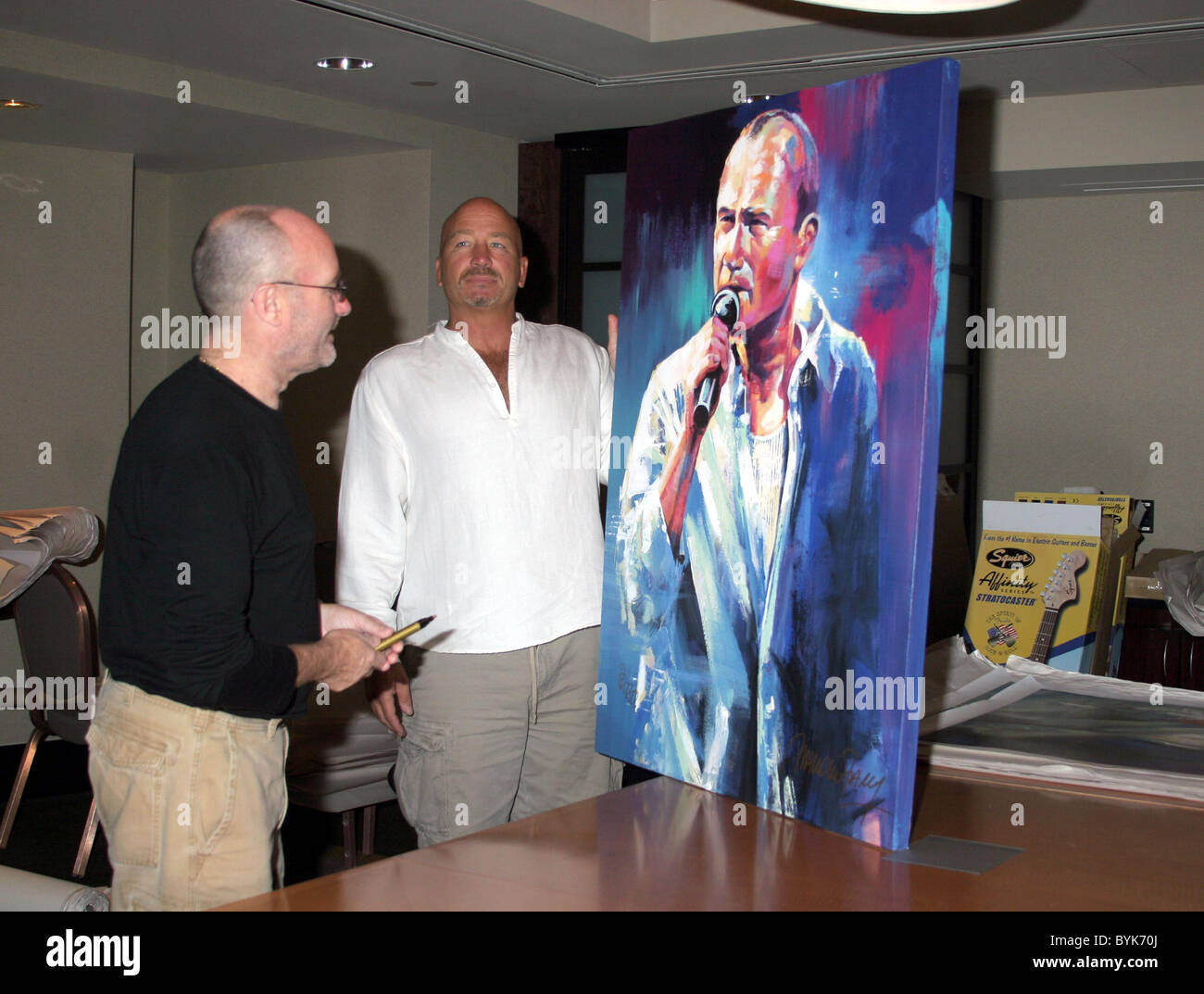 Phil Collins and Malcolm Farley Phil Collins signing of Malcolm Farley ...