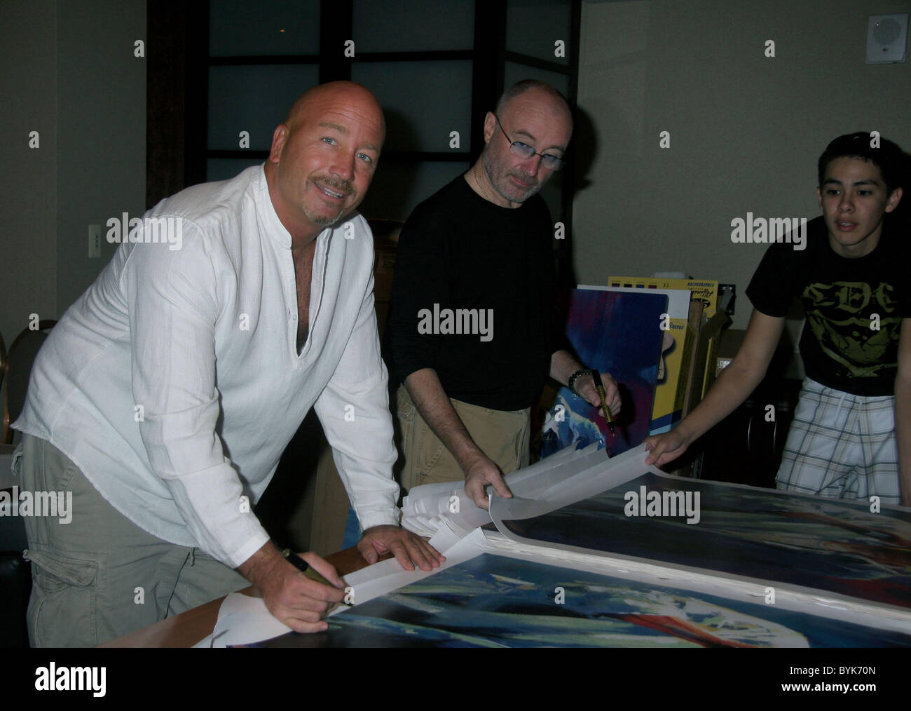 Phil Collins and Malcolm Farley Phil Collins signing of Malcolm Farley ...