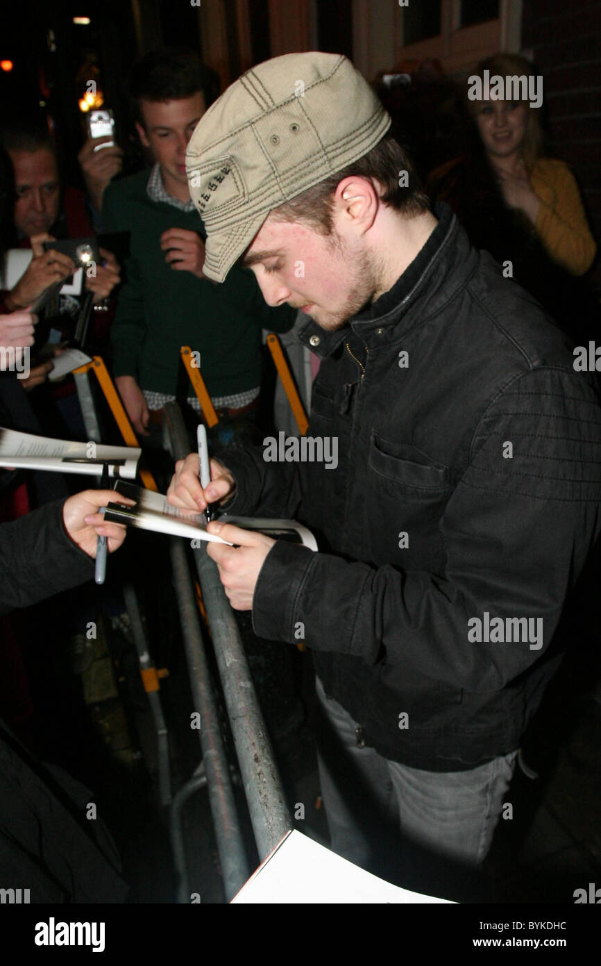 Daniel Radcliffe signing autographs outside the the Gielgud Theatre ...