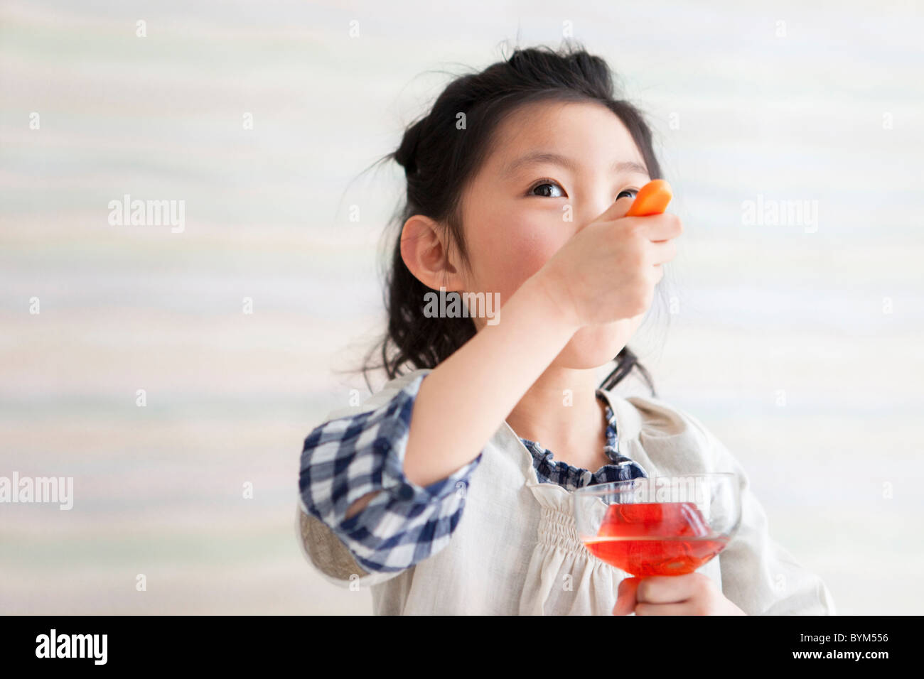 Girl eating jello Stock Photo - Alamy