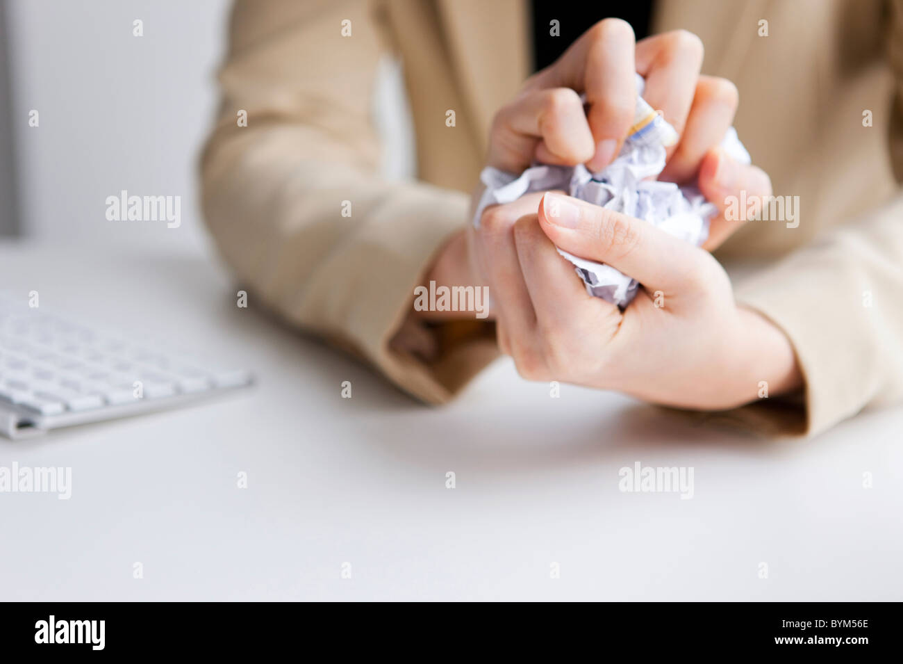 Hands crumpling document Stock Photo - Alamy