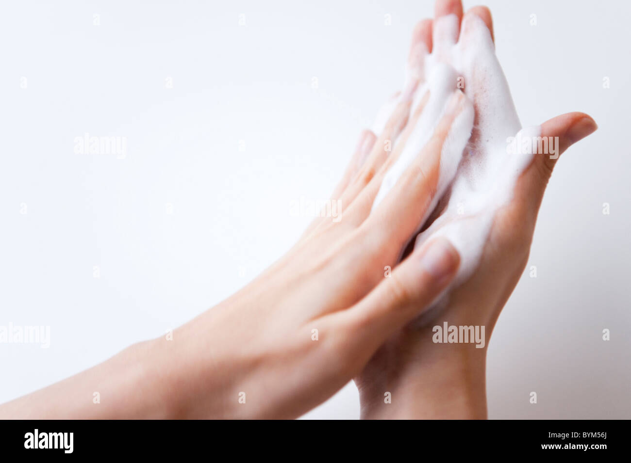 Woman washing hands with soap Stock Photo - Alamy