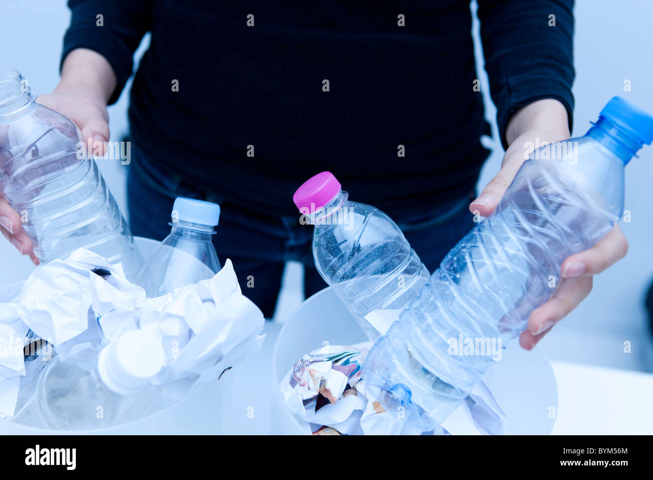 Separating paper and plastics Stock Photo - Alamy