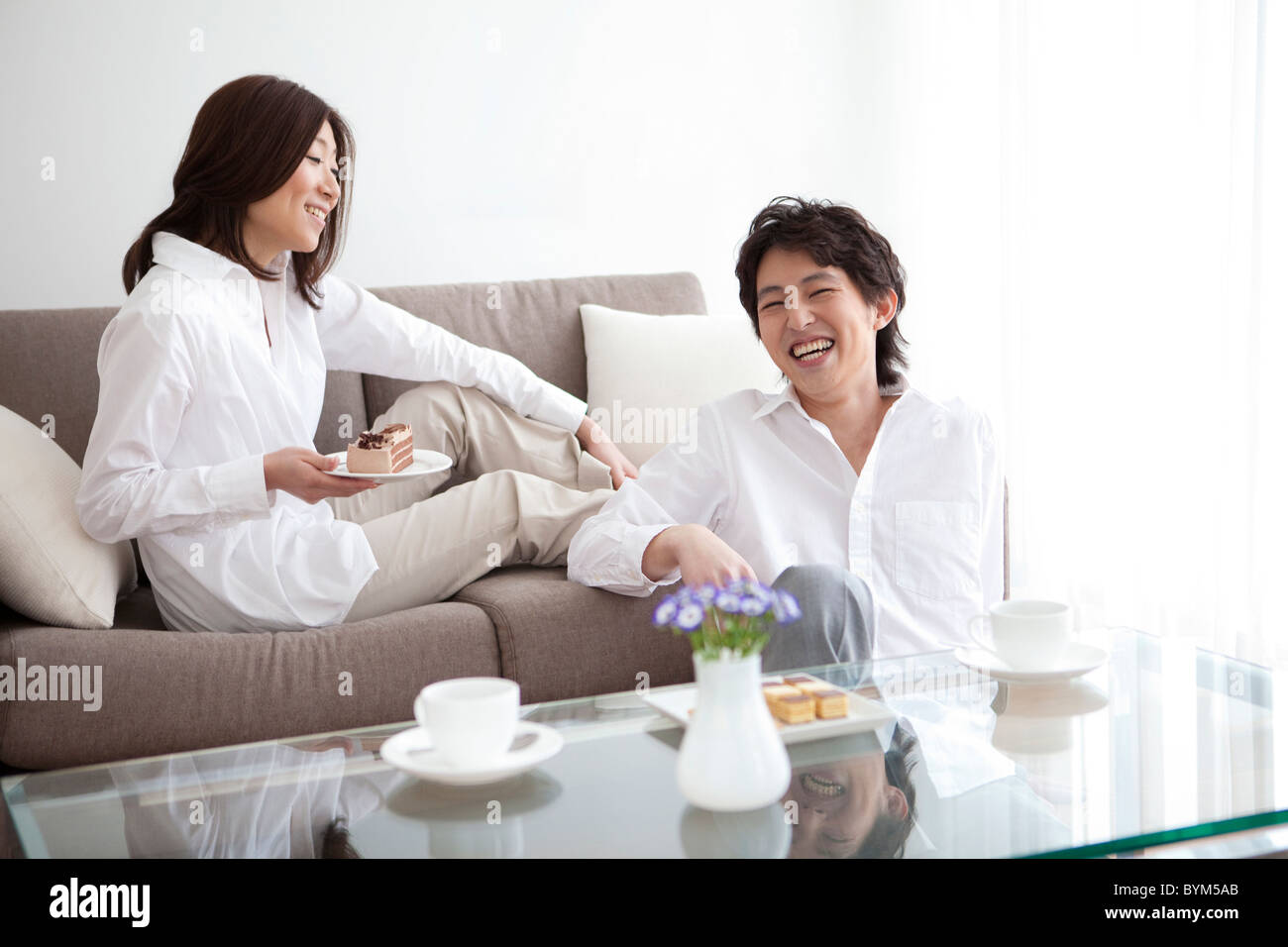 A couple having a teatime Stock Photo - Alamy