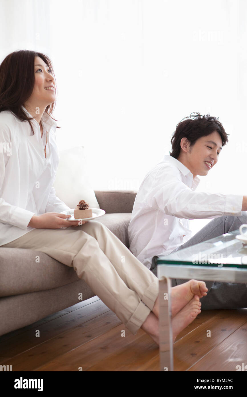 A couple having a teatime Stock Photo - Alamy