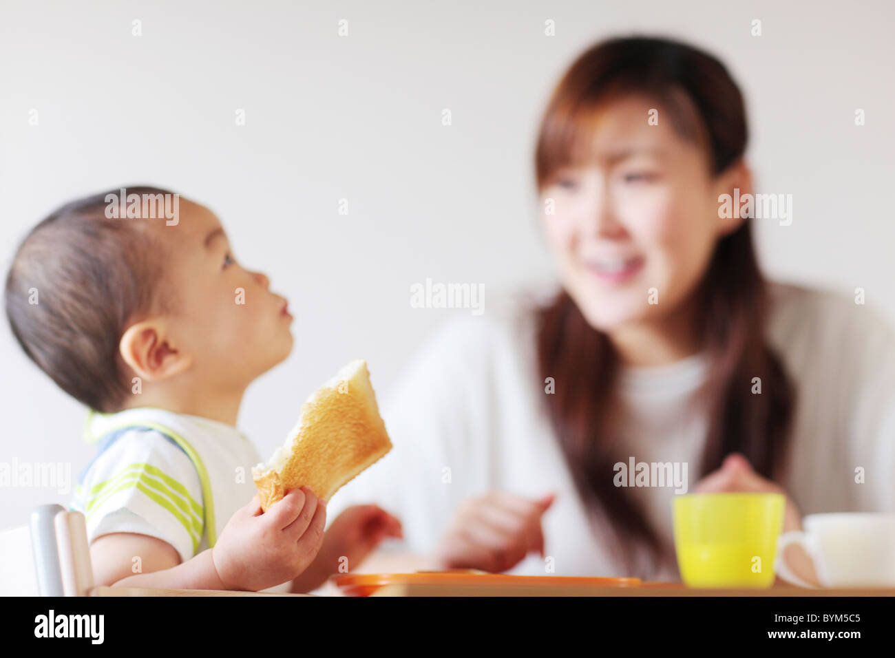 A boy eating breakfast Stock Photo - Alamy
