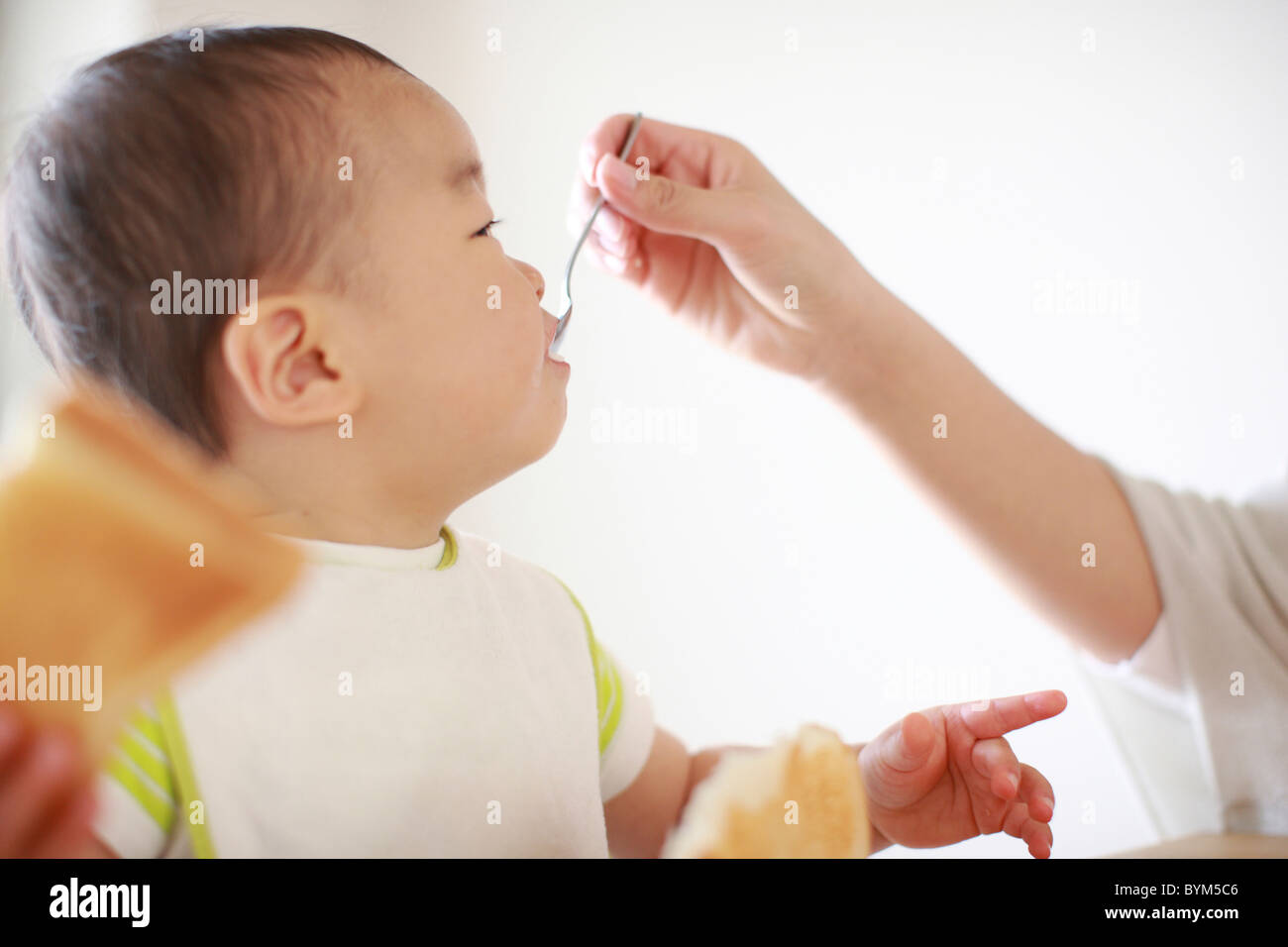 A boy eating breakfast Stock Photo - Alamy