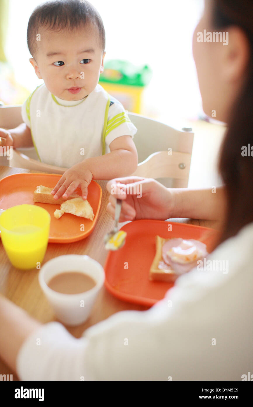 A boy eating breakfast Stock Photo - Alamy