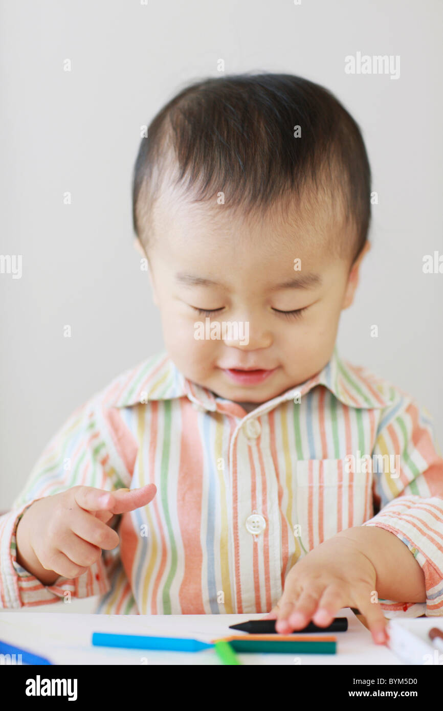 A boy drawing Stock Photo - Alamy