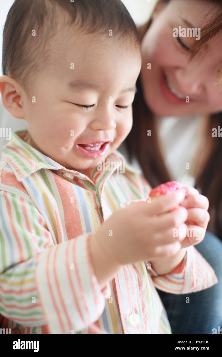 Mother Son Holding Strawberry Watching Smiling Stock Photo - Alamy