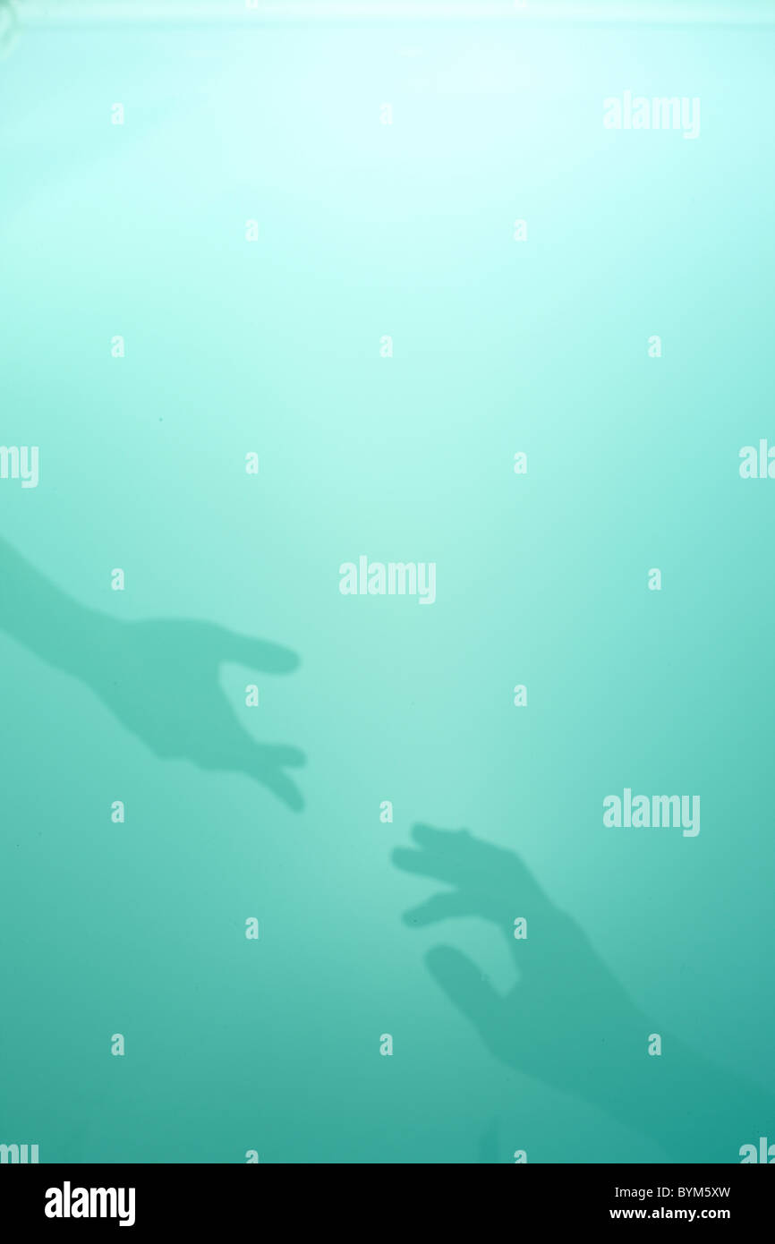 Shadow of Hands Reaching Towards Each Other Stock Photo - Alamy