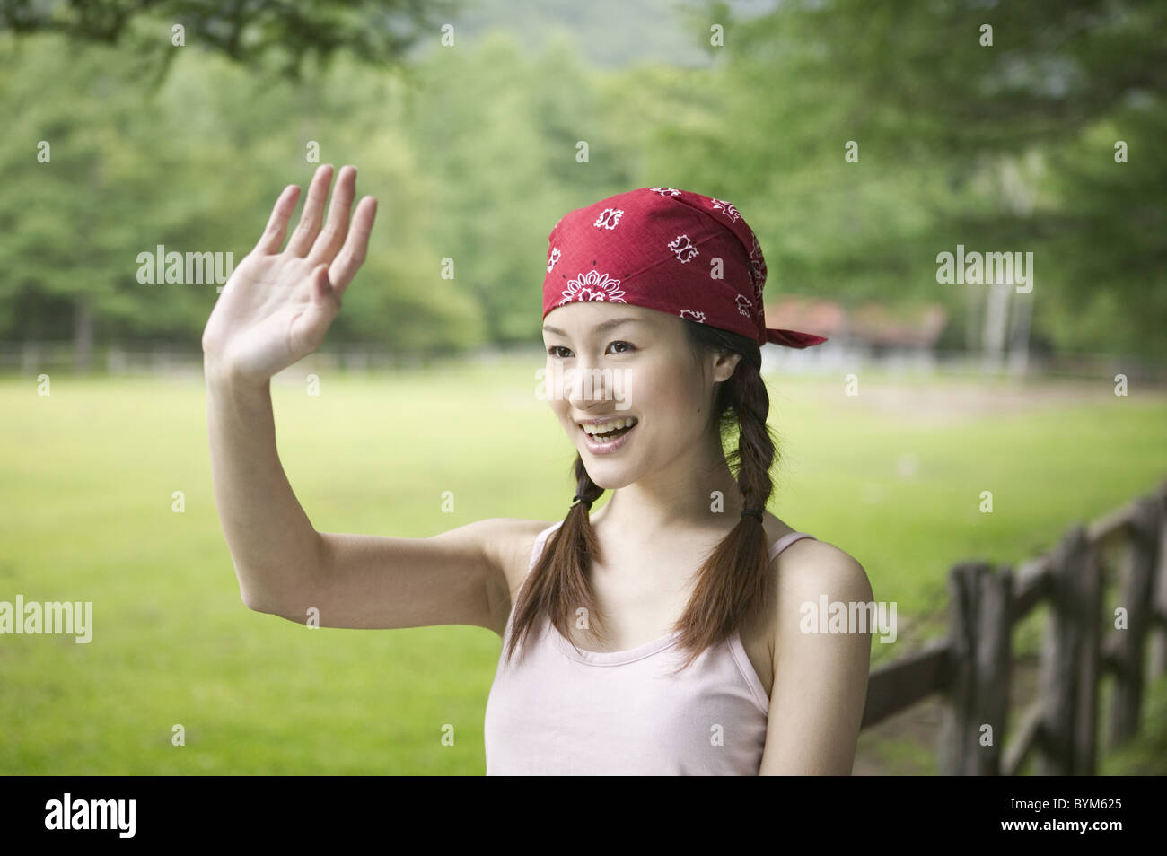 Young Woman Waving Hands Stock Photo - Alamy