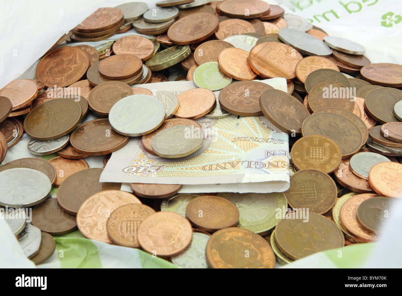 Money bag with plastic coins hi-res stock photography and images - Alamy
