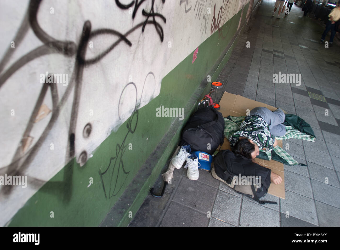 Homeless man asleep in the streets, of Shinjuku, Tokyo, Japan§ Stock ...