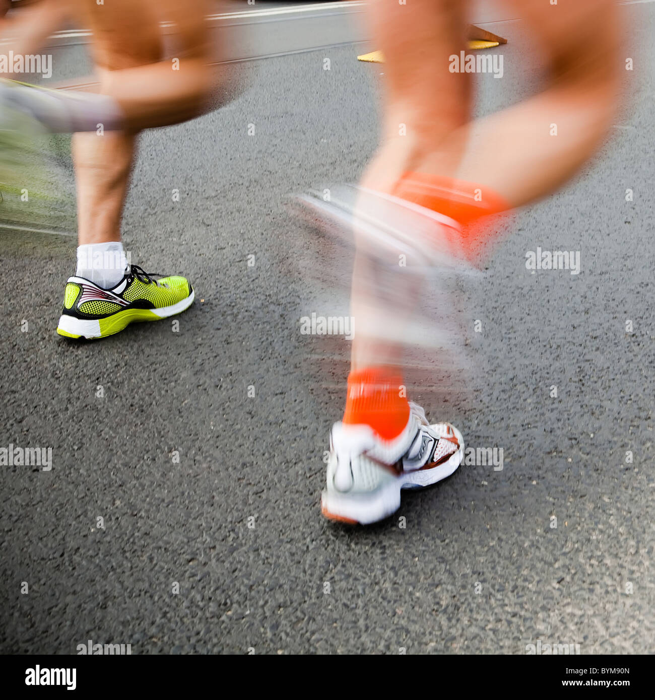 Man running in city marathon - motion blur Stock Photo - Alamy