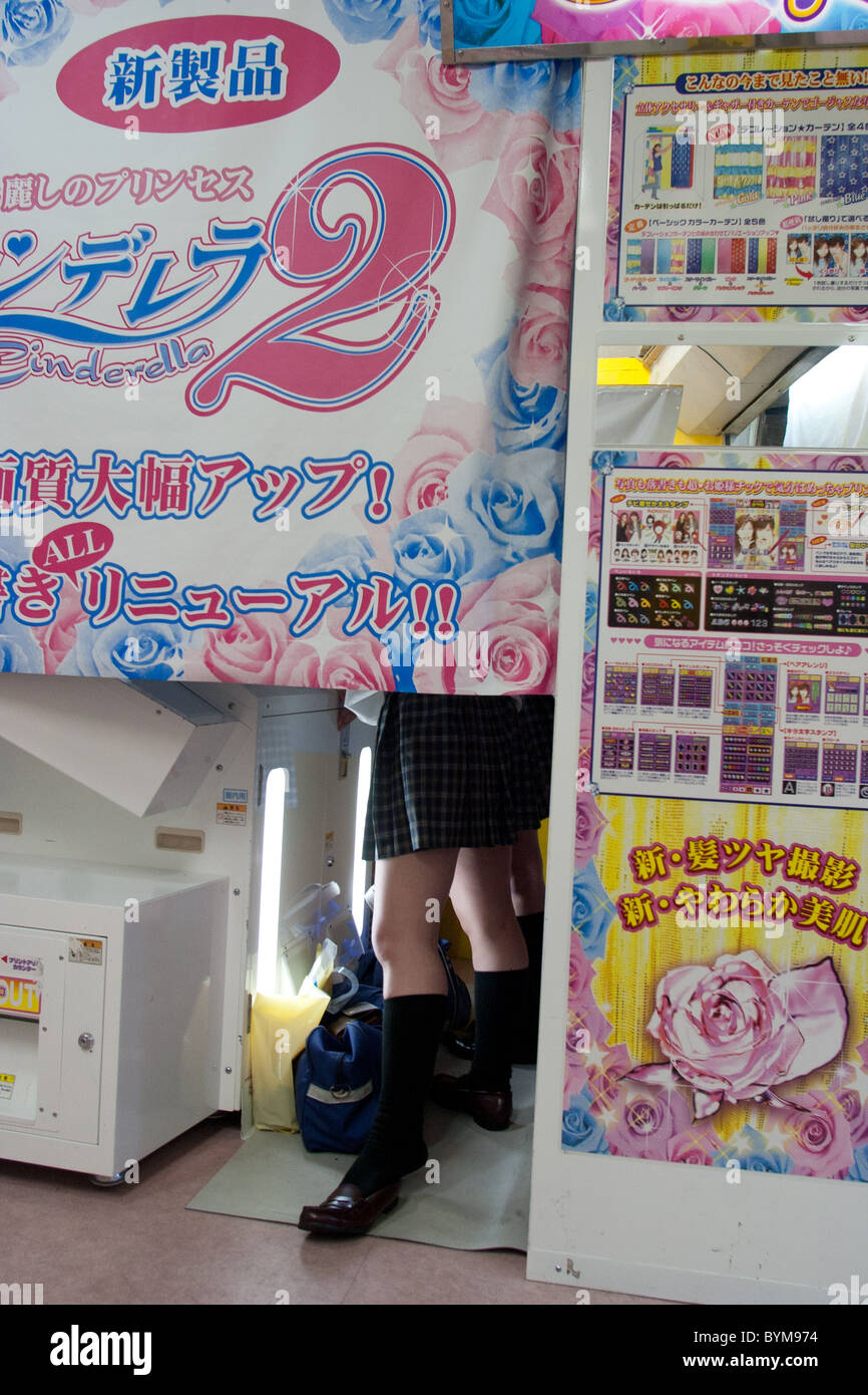 Schoolgirls having their photos taken to print out as stickers- known ...