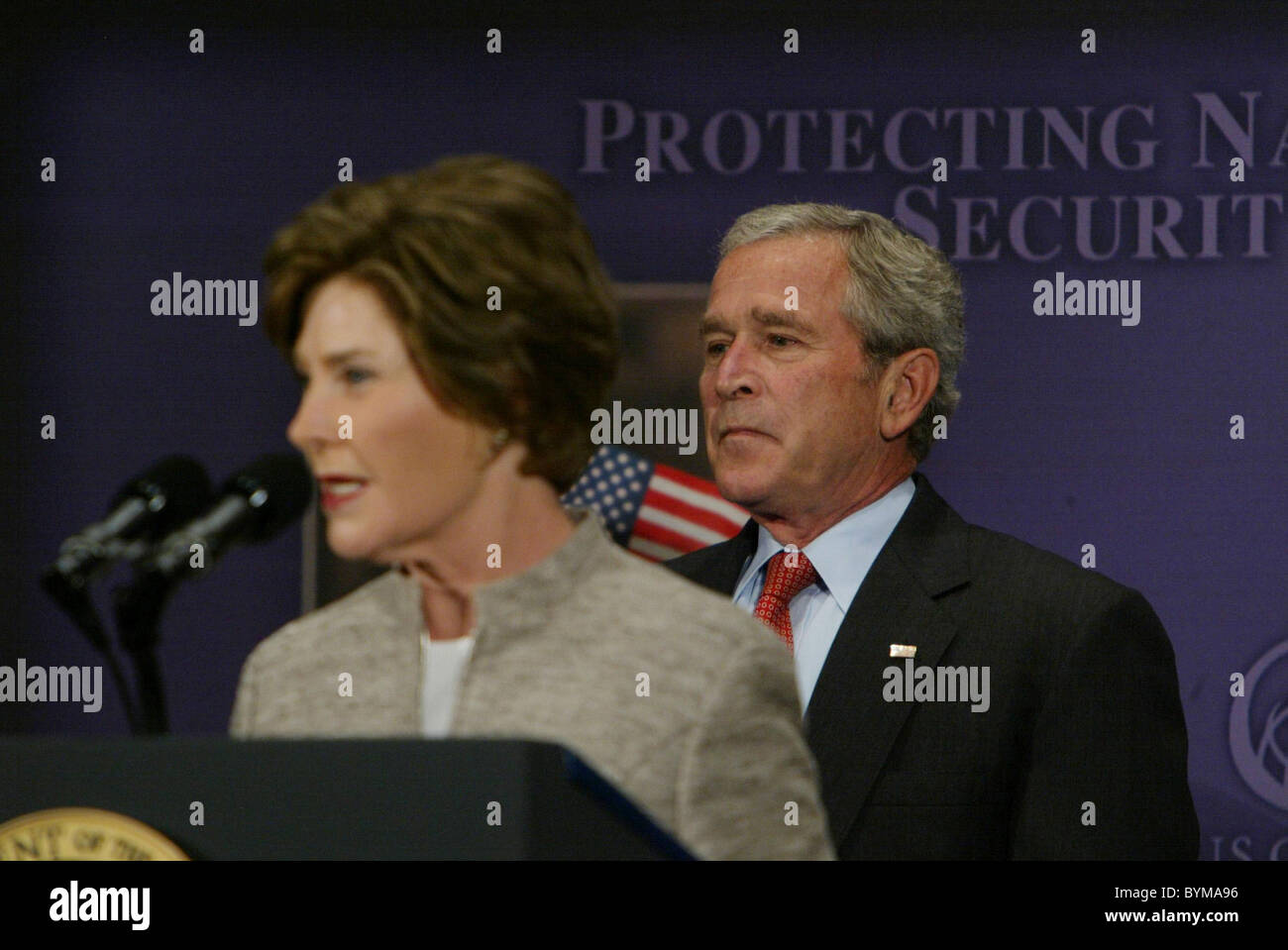 President George W. Bush and First Lady Laura Bush address an audience ...