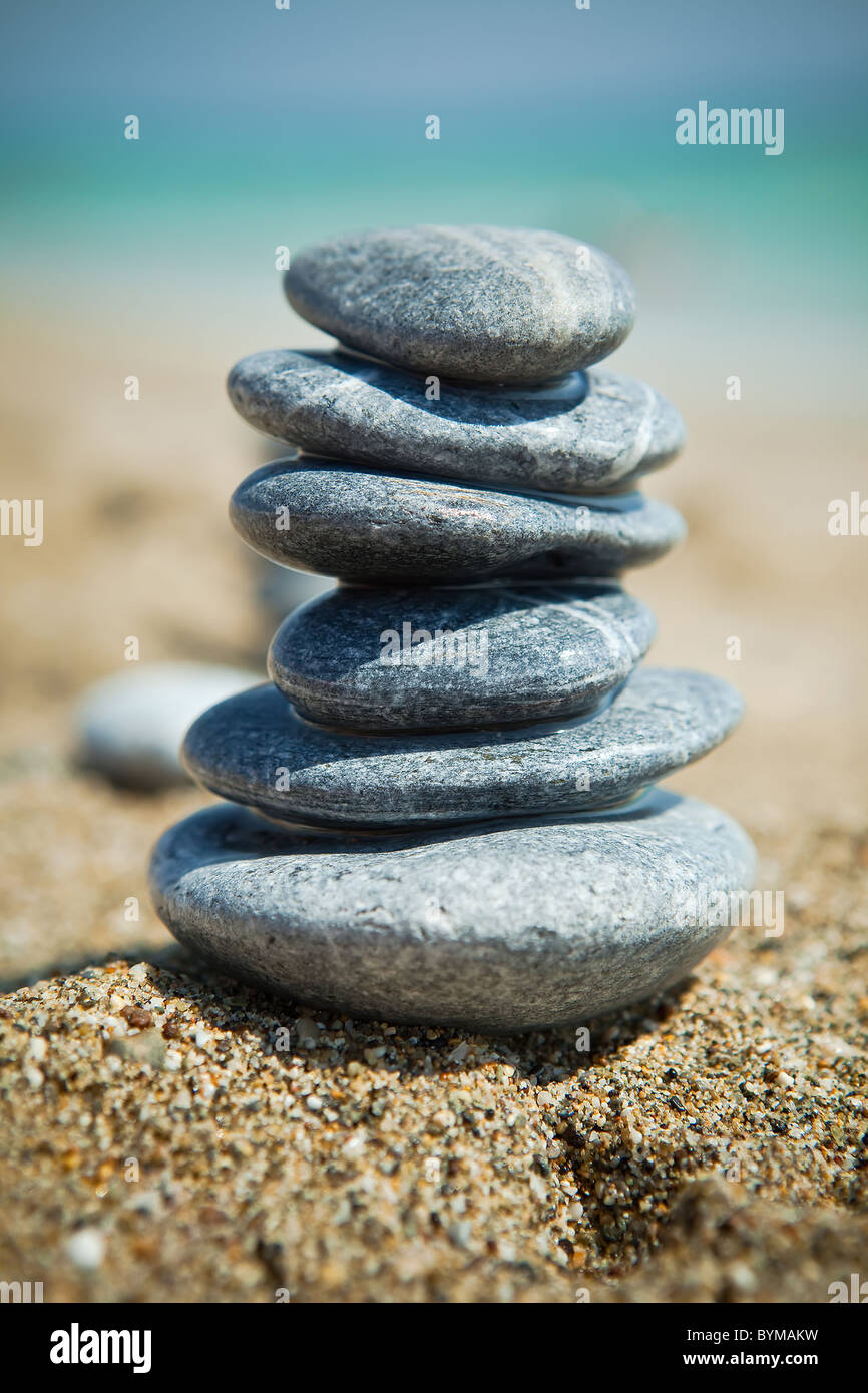 Stone stacks on a pebble beach Stock Photo - Alamy