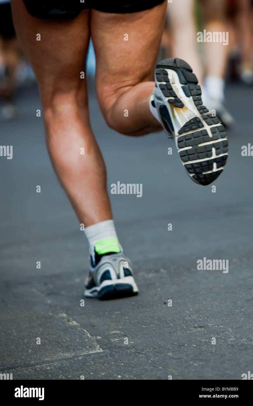 Man running in city marathon Stock Photo - Alamy