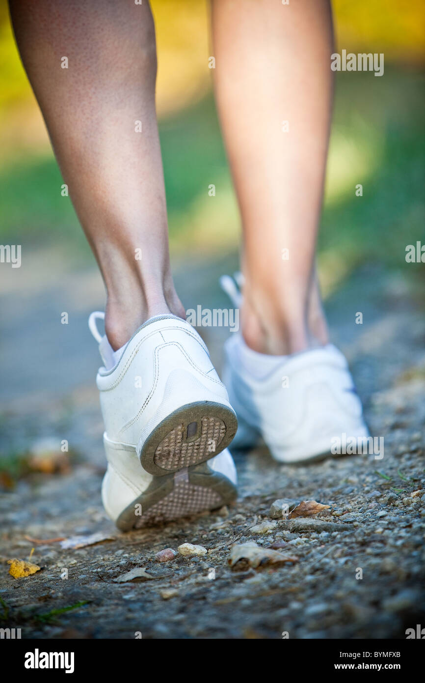 Woman walking cross country and trail Stock Photo - Alamy Woman walking cross country and trail Stock Photo - Alamy