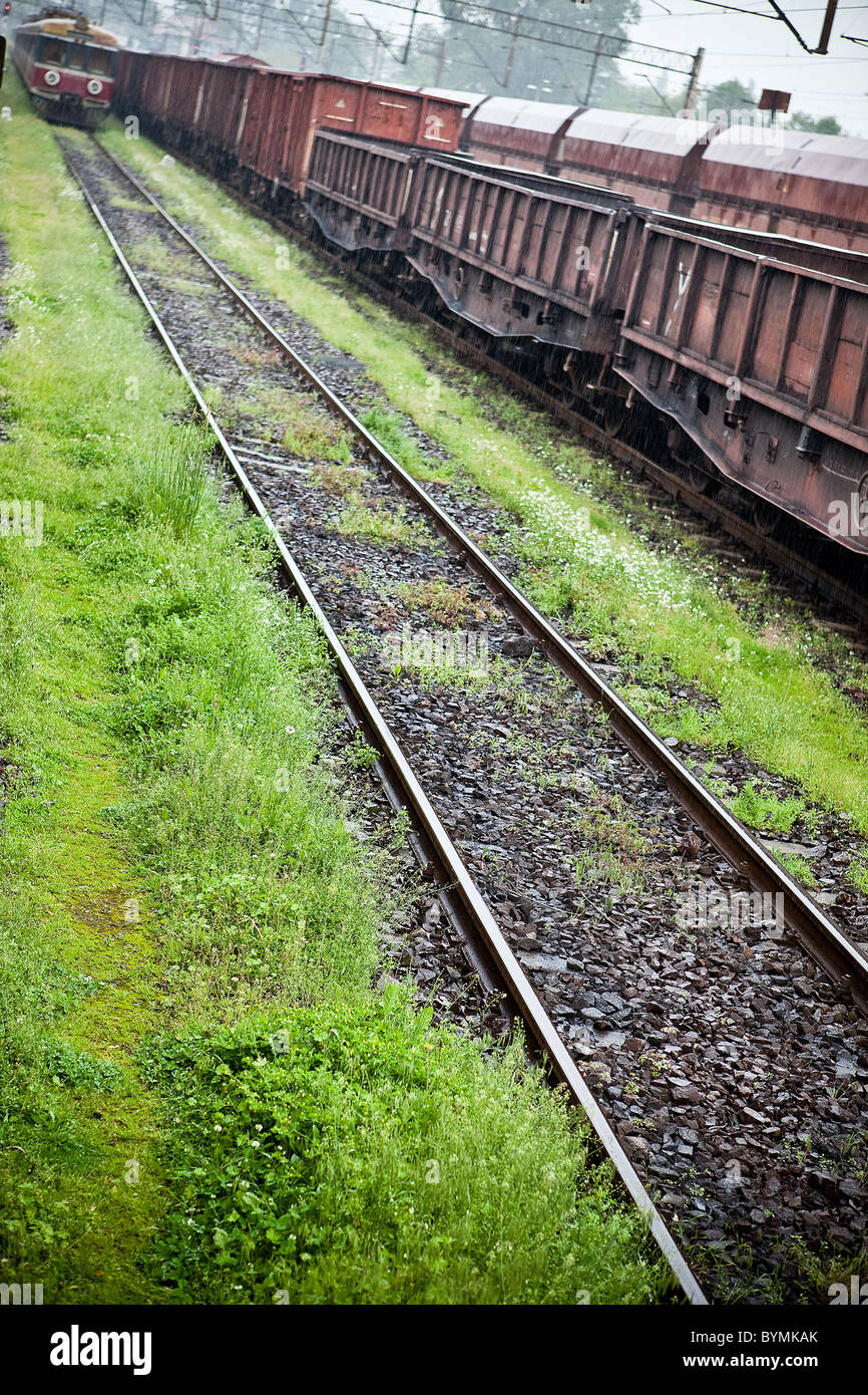 Cargo wagons in the train station during rain Stock Photo - Alamy