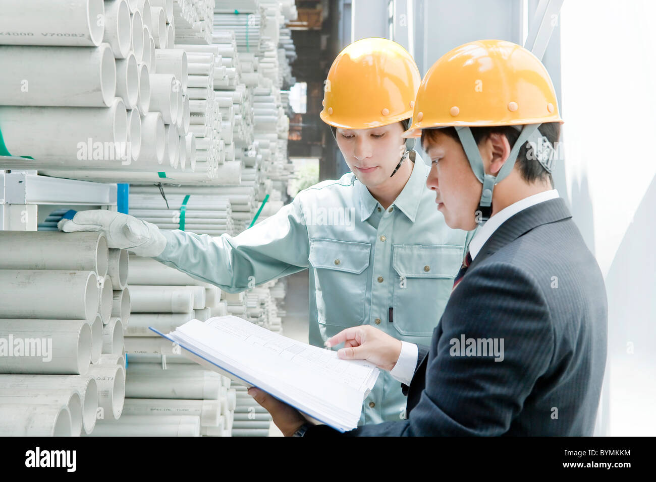 Boss and Labourer at Warehouse Stock Photo - Alamy