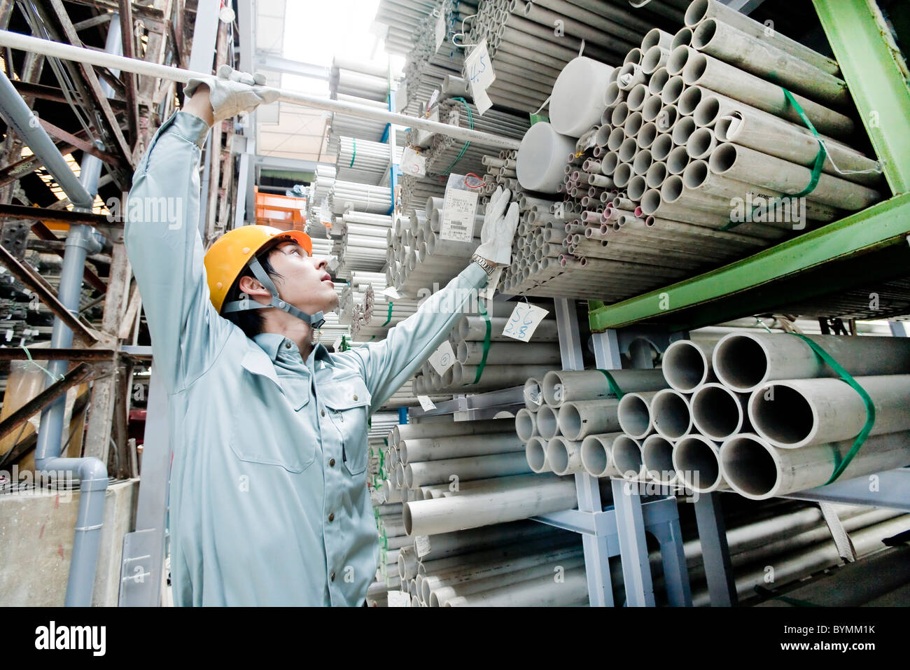 Construction worker placing pipe hi-res stock photography and images ...