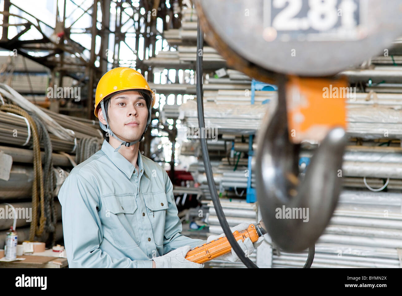 Young Man Operating Pulley Stock Photo - Alamy